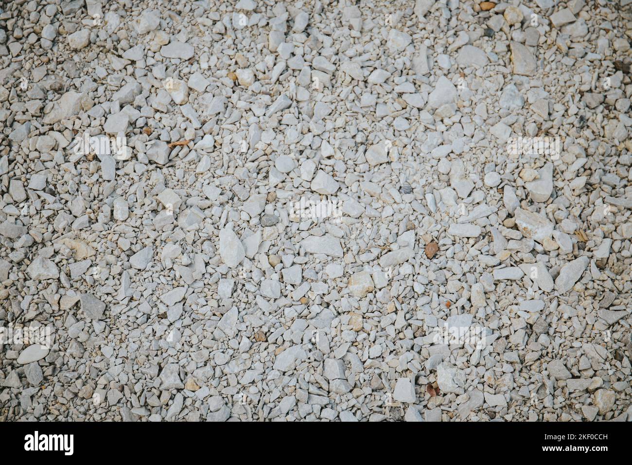 A top view of pebbled ground texture Stock Photo - Alamy