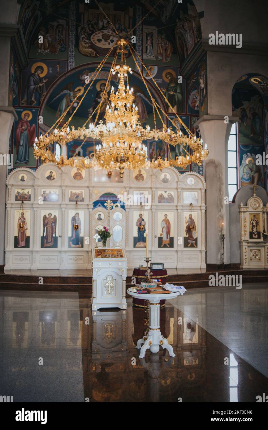 A vertical shot of a beautiful alter with icons and relics in an ...