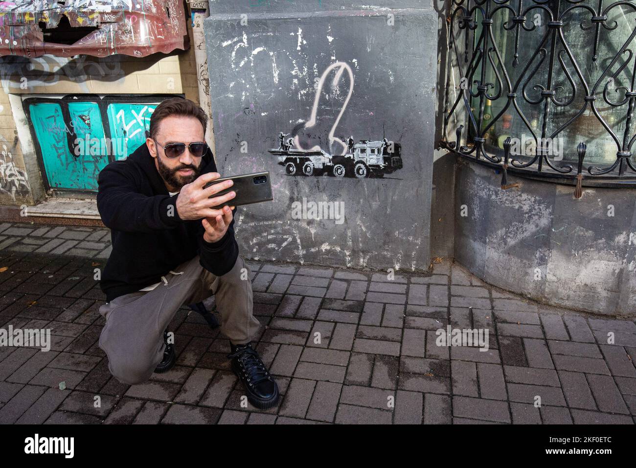 Kyiv, Ukraine. 14th Nov, 2022. A man takes a selfie in front of a ...