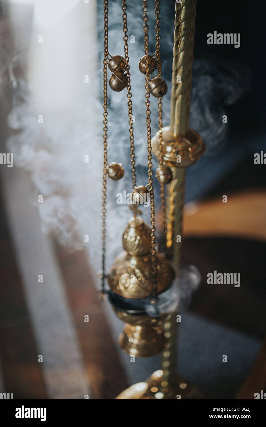 A censer hanging in the church with aromatic incense strewn on lighted ...