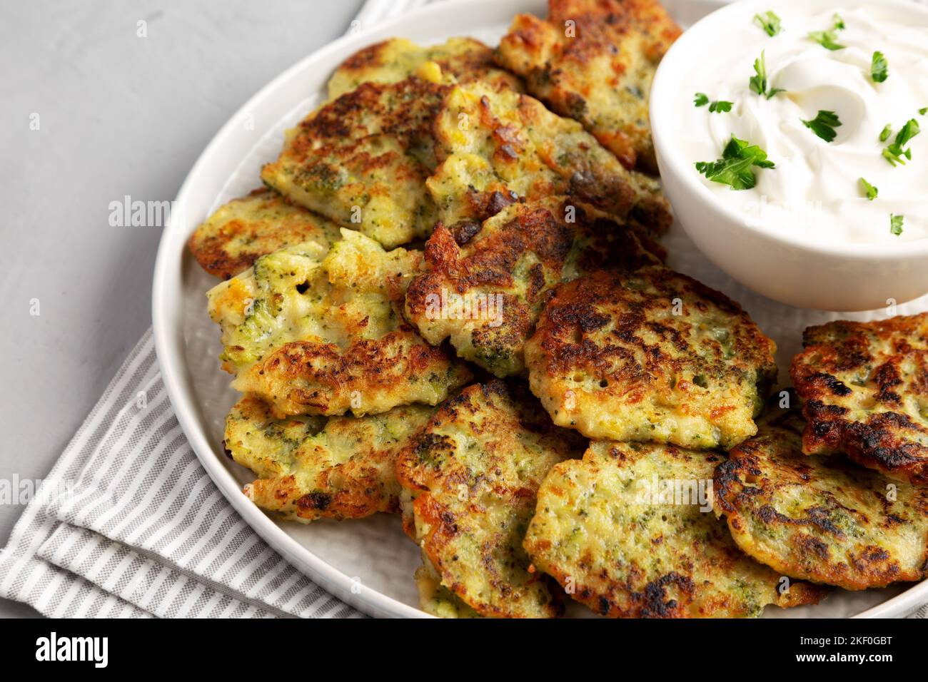 Homemade Broccoli Cheddar Fritters on a Plate, side view. Close-up ...