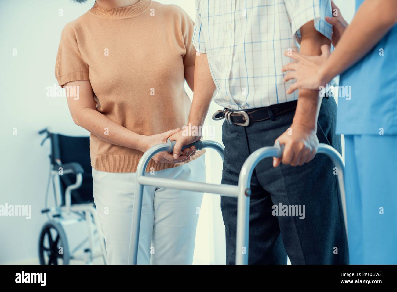 Elderly woman helped up hi-res stock photography and images - Alamy