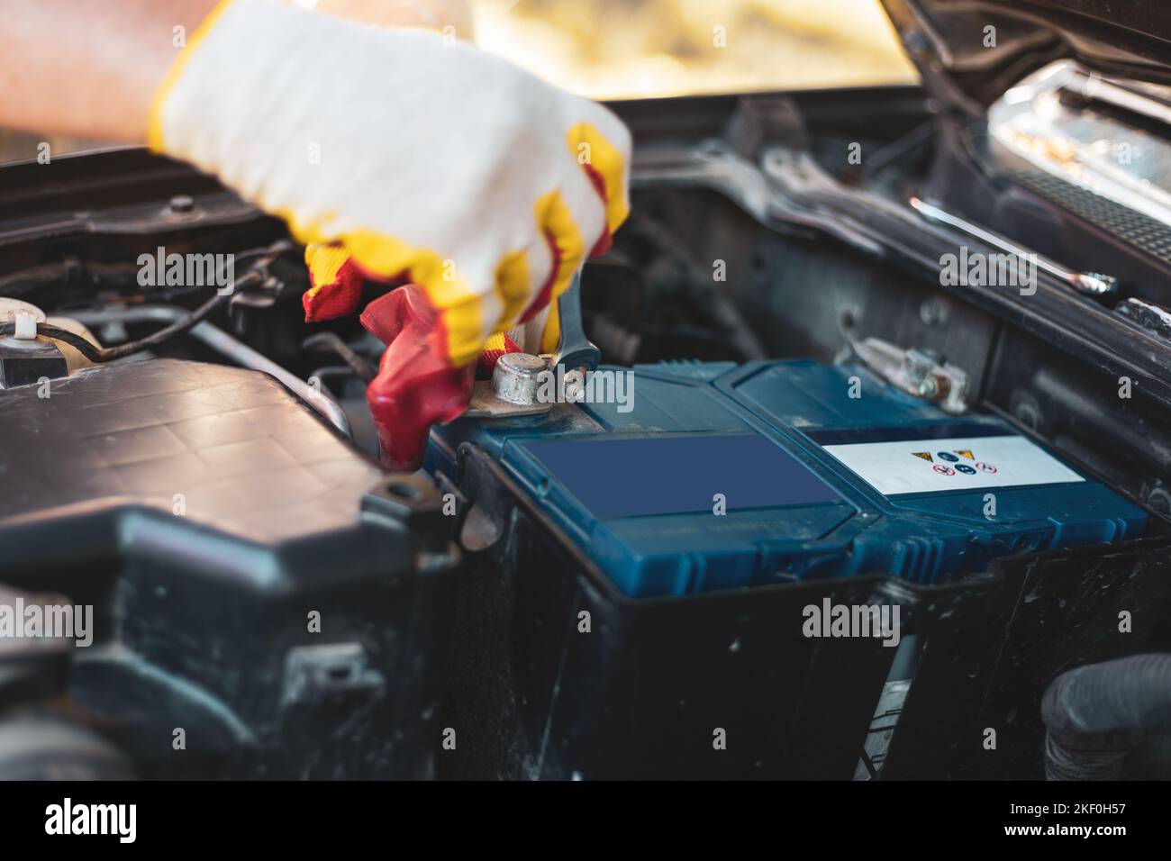 Car battery repair and replacement. The mechanic is servicing the car ...