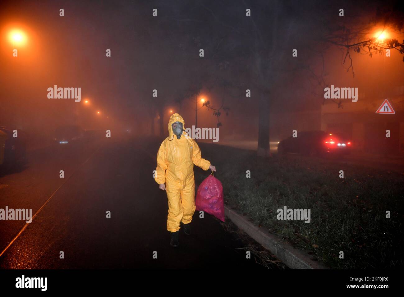 Person in yellow overall walking hi-res stock photography and images ...
