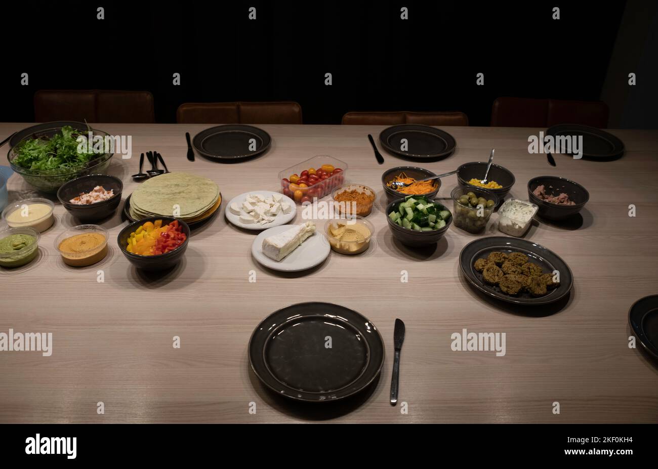 set table for lunch with various ingredients for salad Stock Photo - Alamy