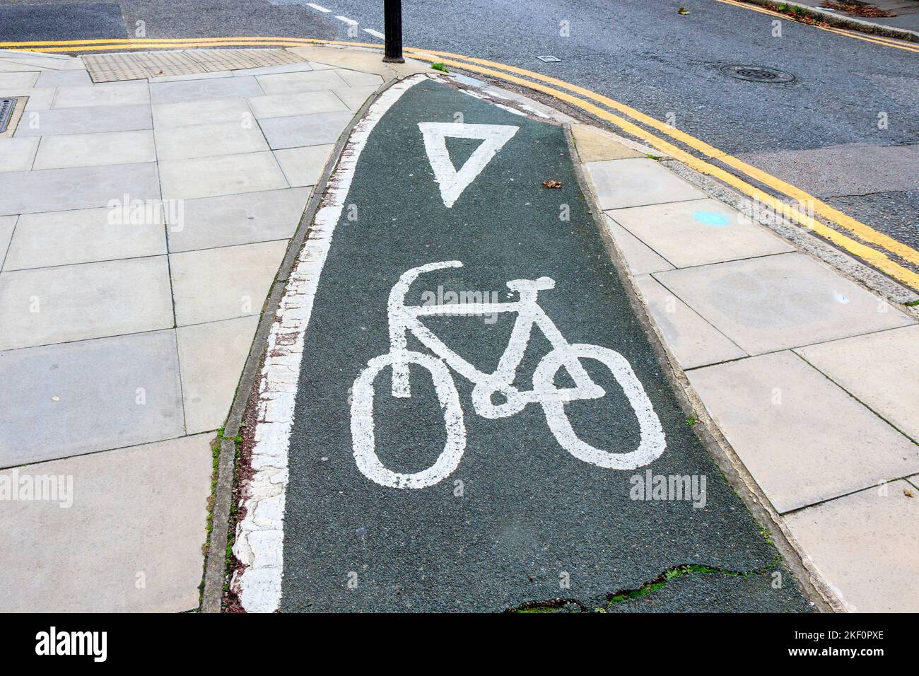 A dedicated cycle path merging with a public highway, London, UK Stock ...