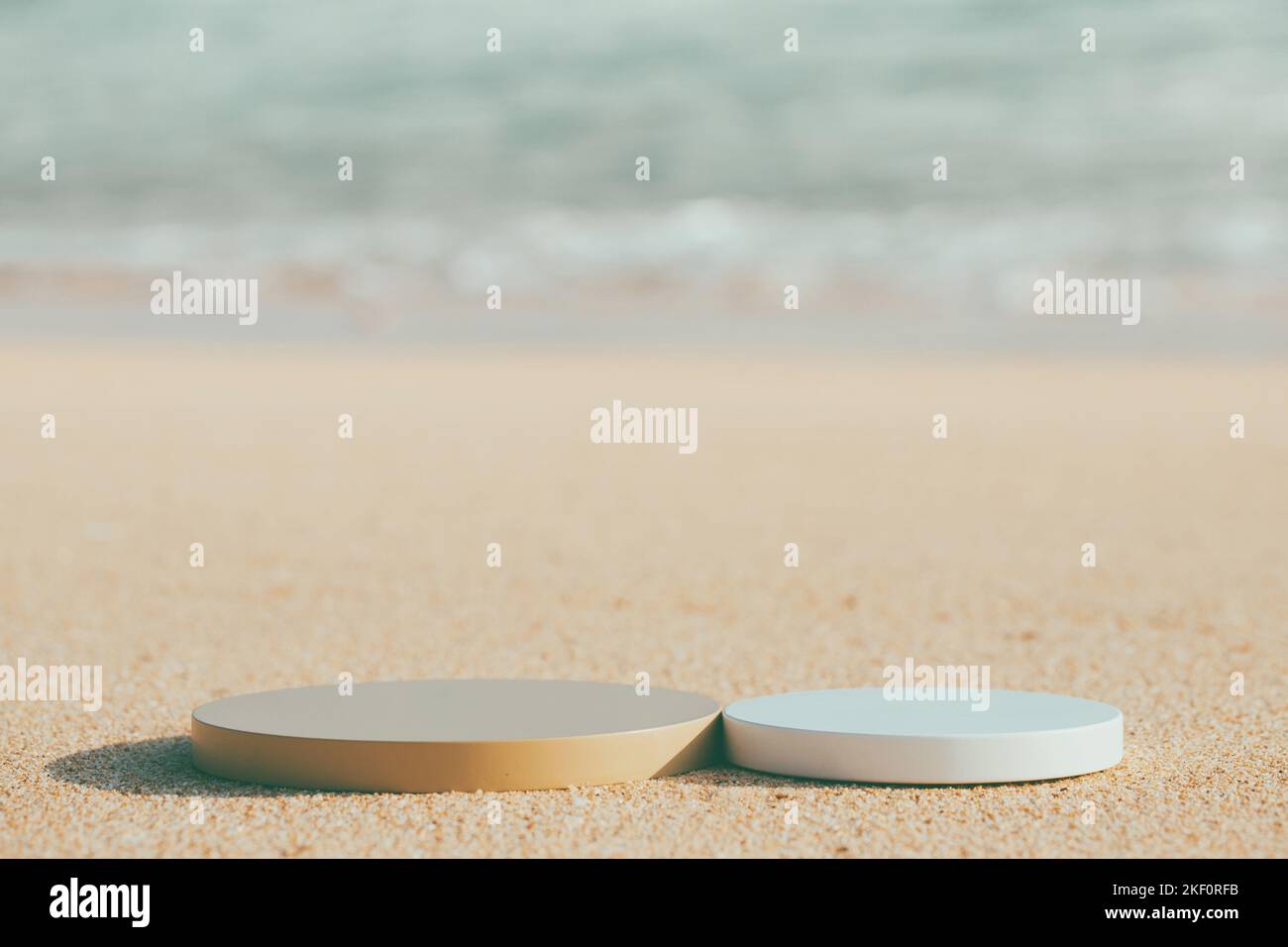 Two empty round platform podiums on the beach sand Stock Photo - Alamy