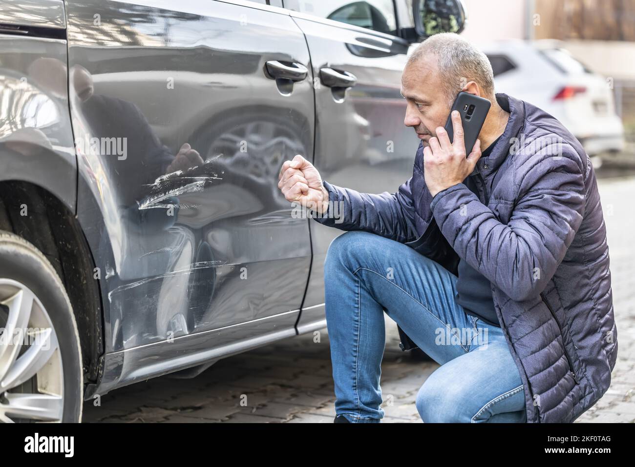 An angry driver calls the insurance company or the police because of a ...