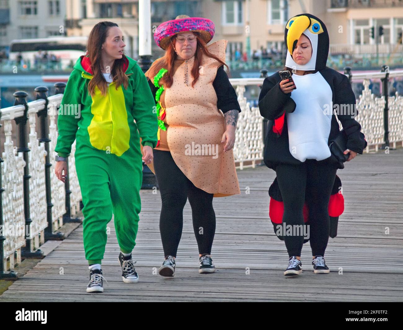 Fancy dress costumes on Brighton Pier Stock Photo - Alamy