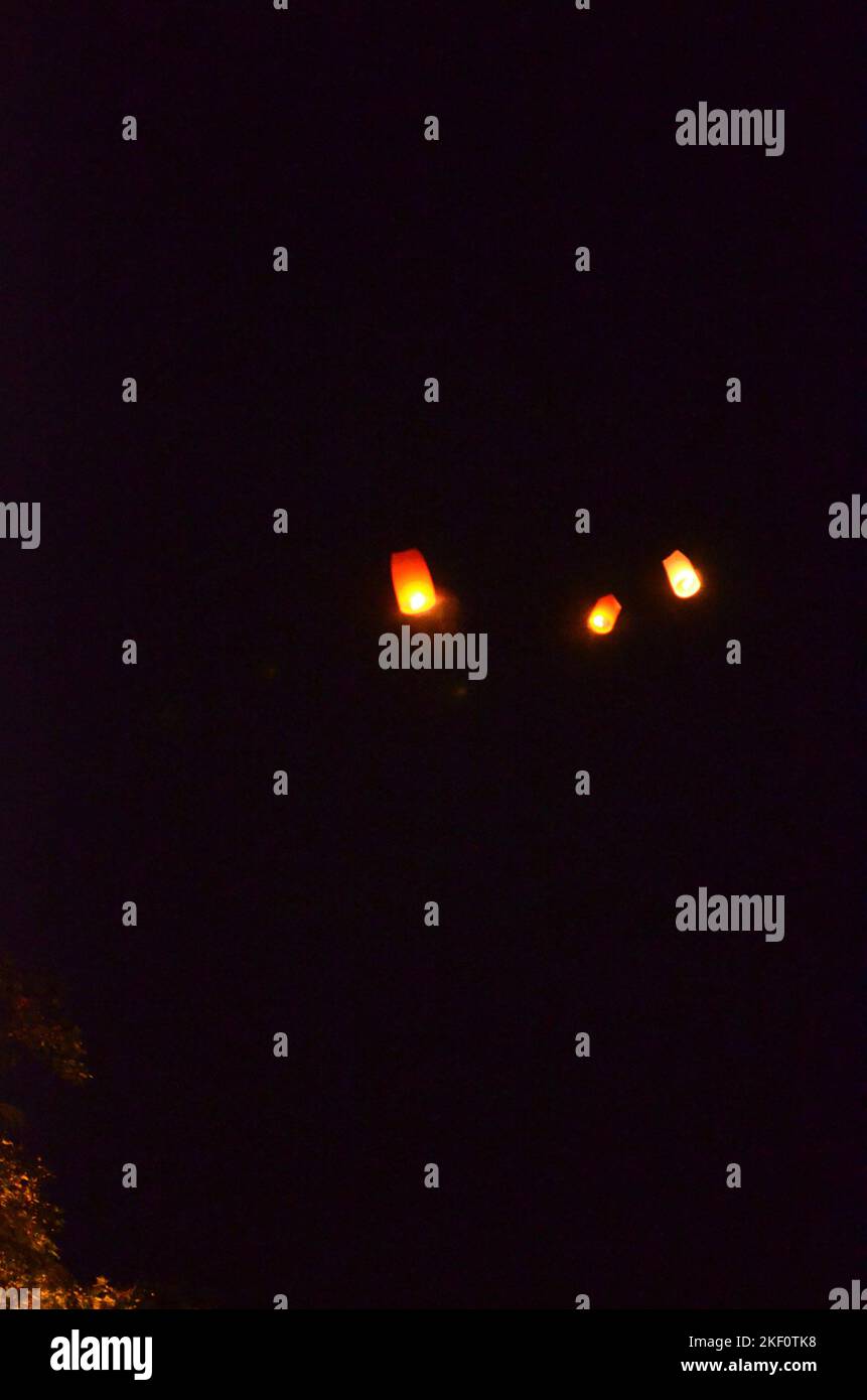 Starting a Floating Lamp Latern at beach in Thailand Stock Photo - Alamy