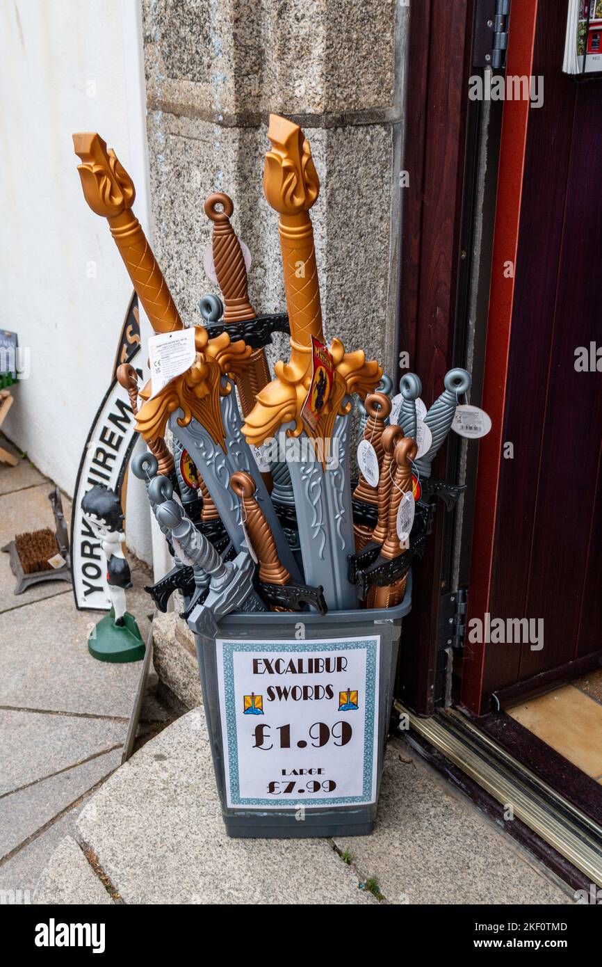 In Tintagel village plastic Excalibur swords are sold from a bucket ...