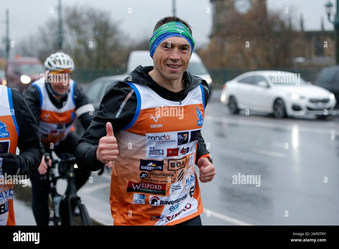 Kevin Sinfield shows a thumbs up to members of the public as he crosses ...