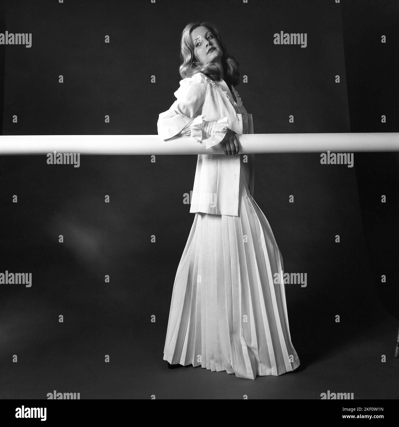 Fashion studio shoot for evening ware in 1971 Stock Photo - Alamy