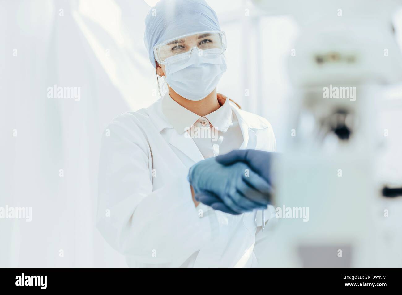 close up. Microbiology scientists shaking hands. science and health ...