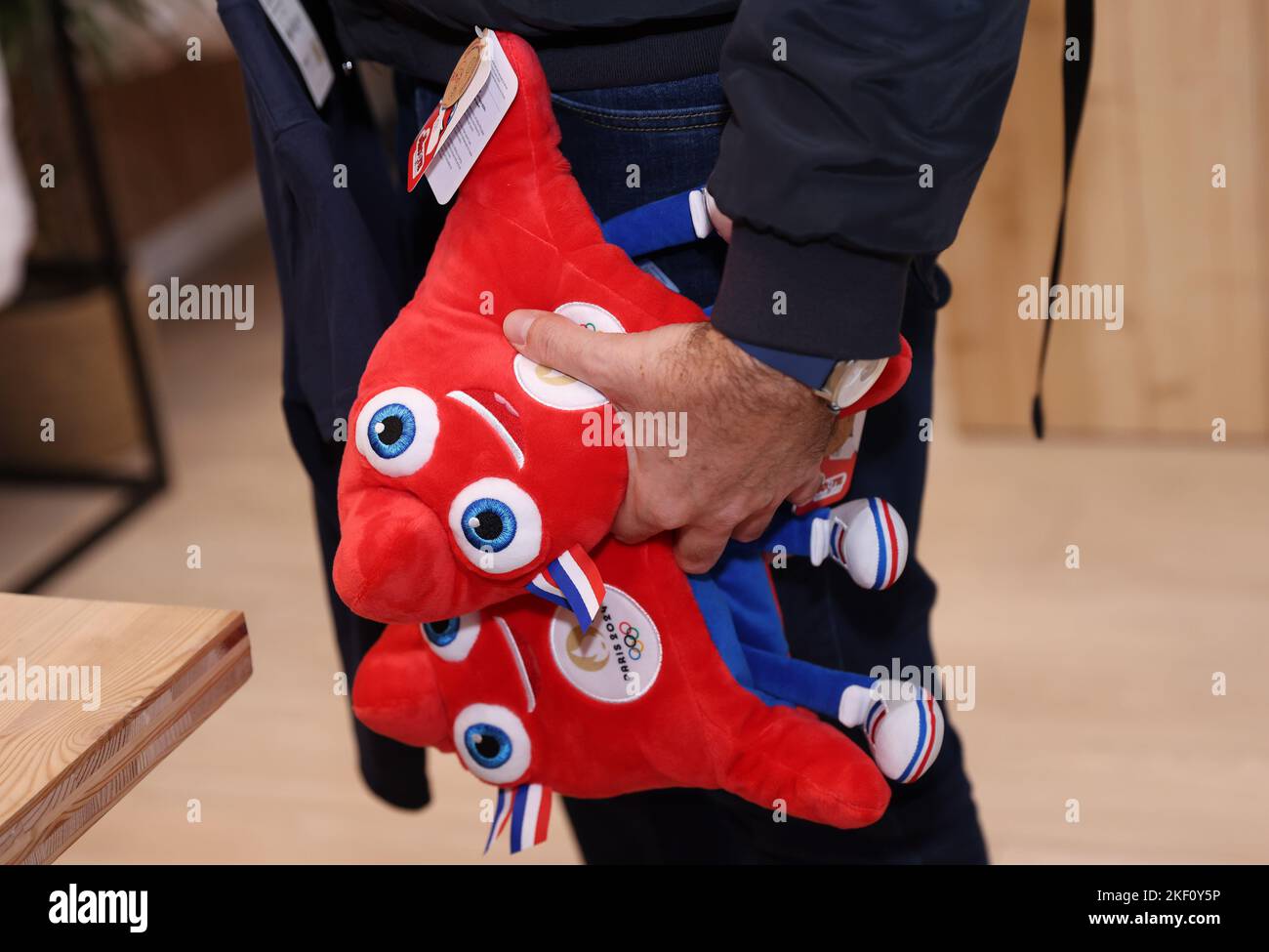Paris, France. 15th Nov, 2022. A customer purchases licensed products ...