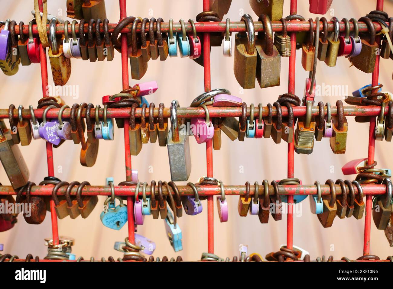 Many love padlocks locked on rusty iron gate in singapore Stock Photo ...
