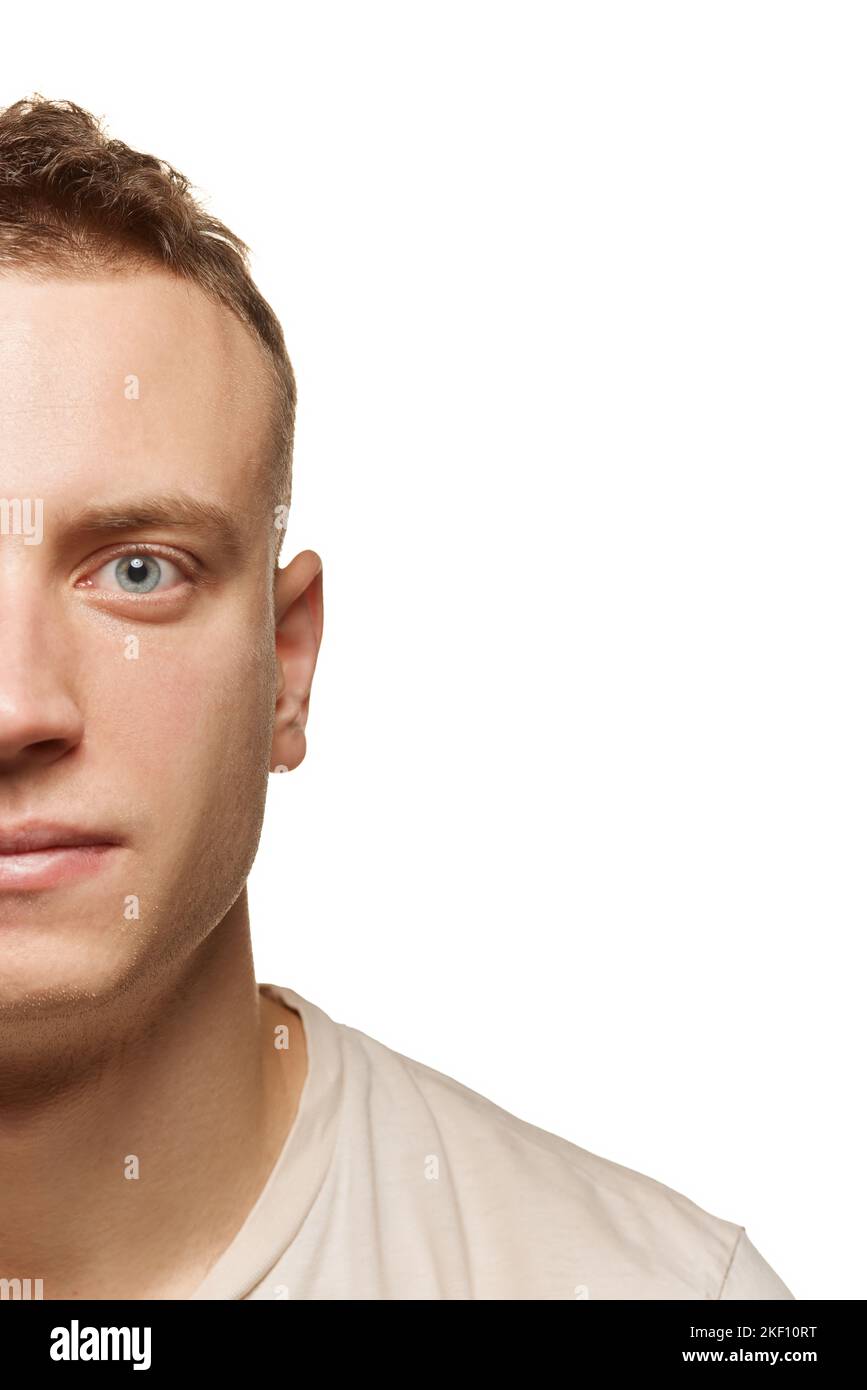 Half-face portrait of young man with shaved face and smooth perfect ...