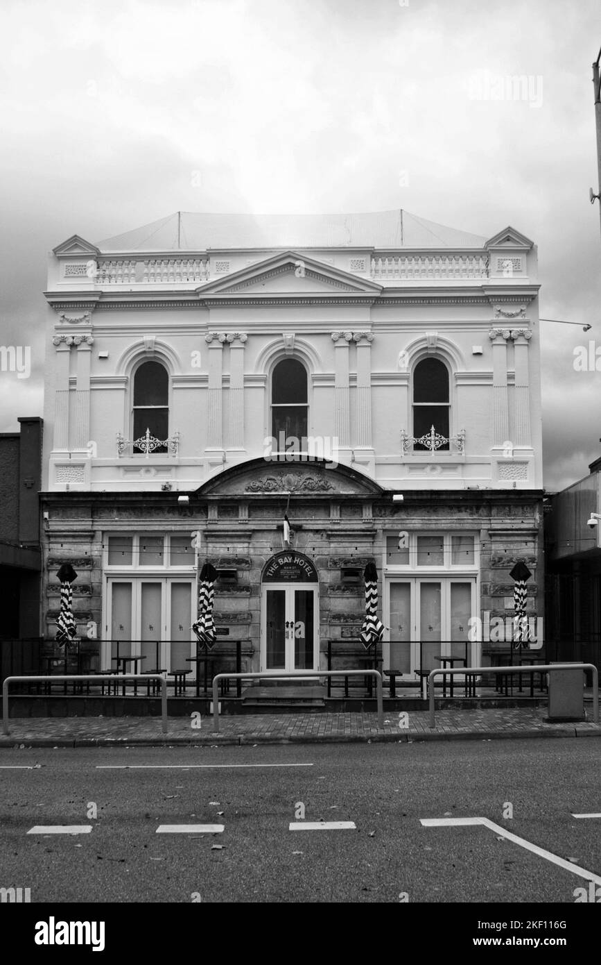An old style retro building on the main street in Mornington, grayscale ...