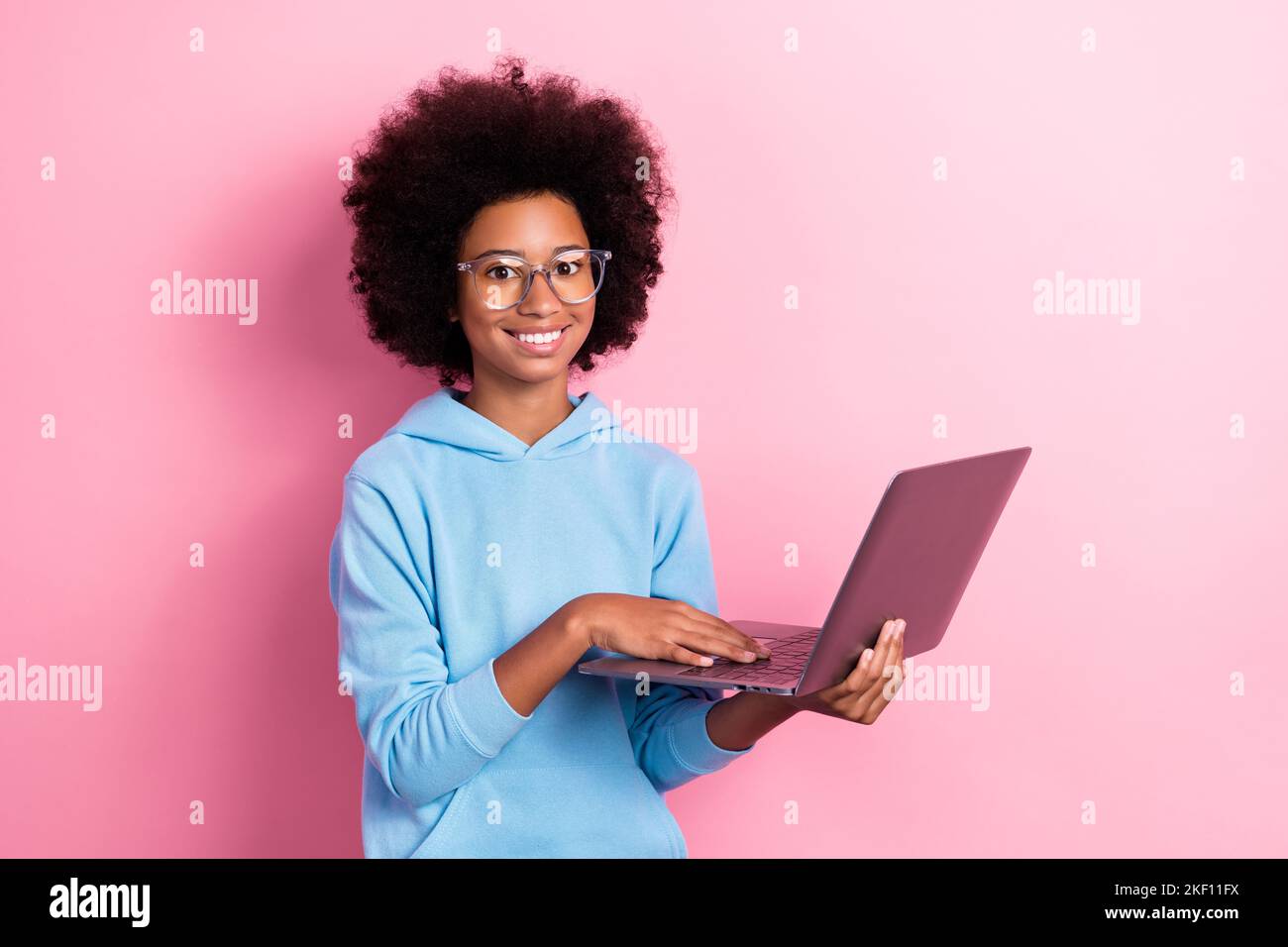 Photo portrait of adorable school girl study online netbook nerd typing ...