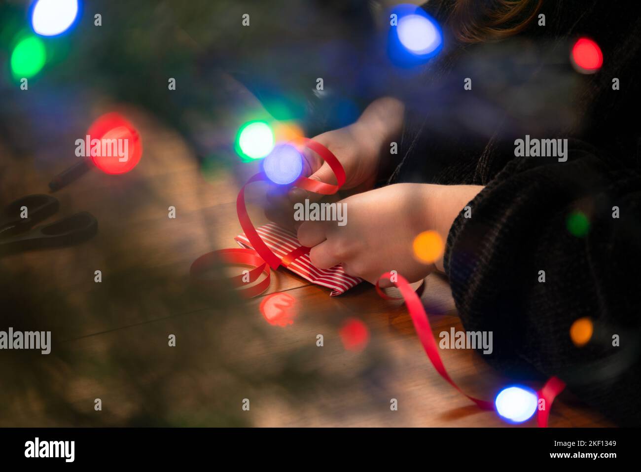 Woman hands tied up ribbon hi-res stock photography and images - Alamy