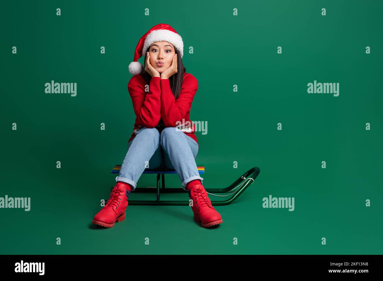 Full length photo of flirty girl dressed red x-mas pullover sending ...