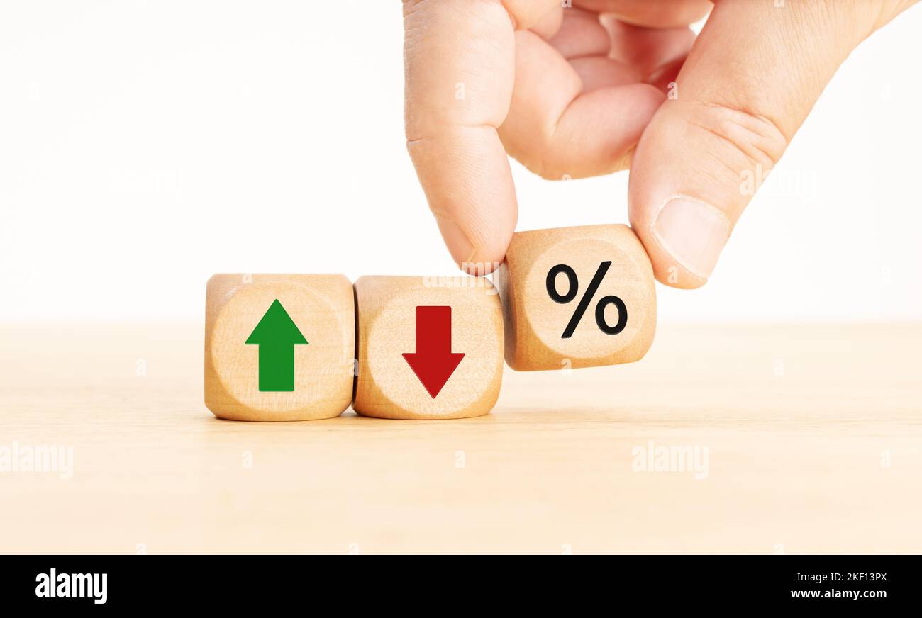 Stock market, Business and finance concept. Hand holding a Wooden block ...