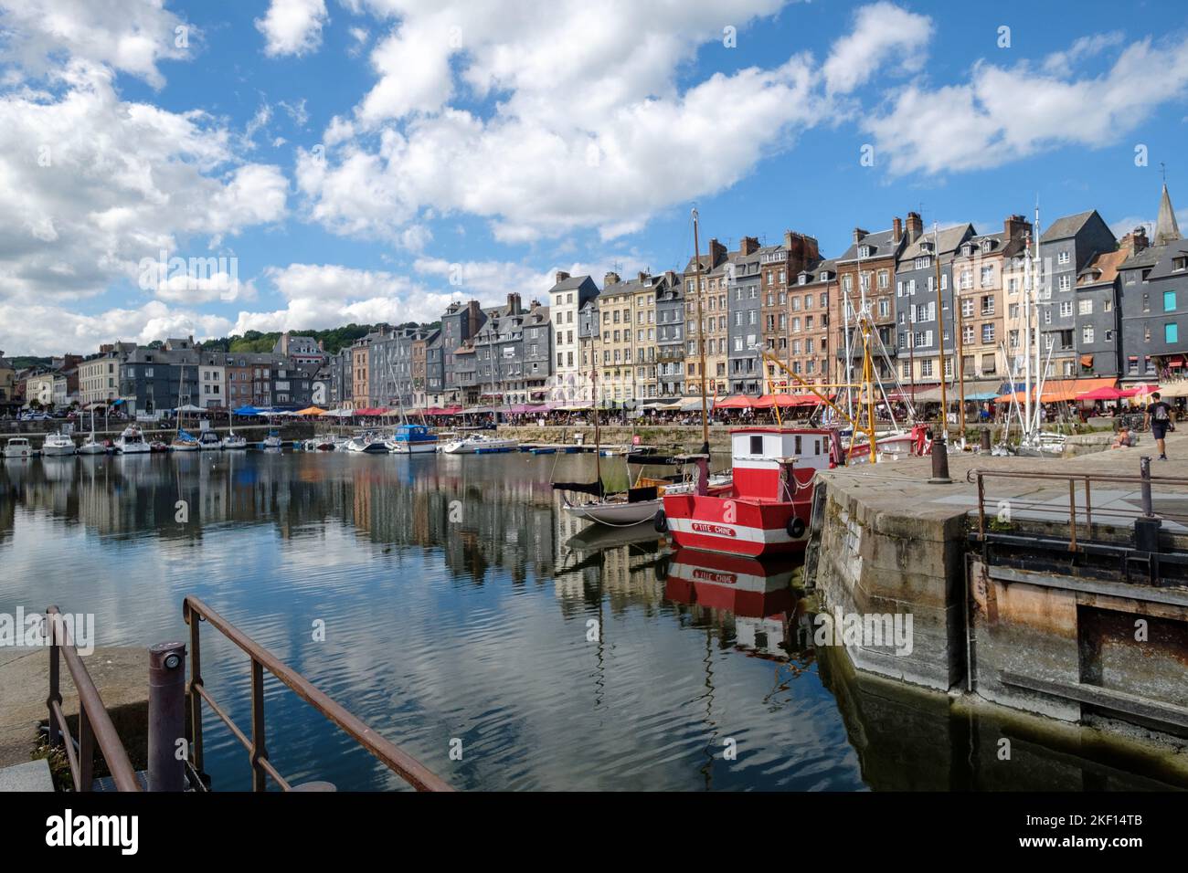 The harbour at Honfleur, Normandy, in Summer 2022, surrounded by cafes ...