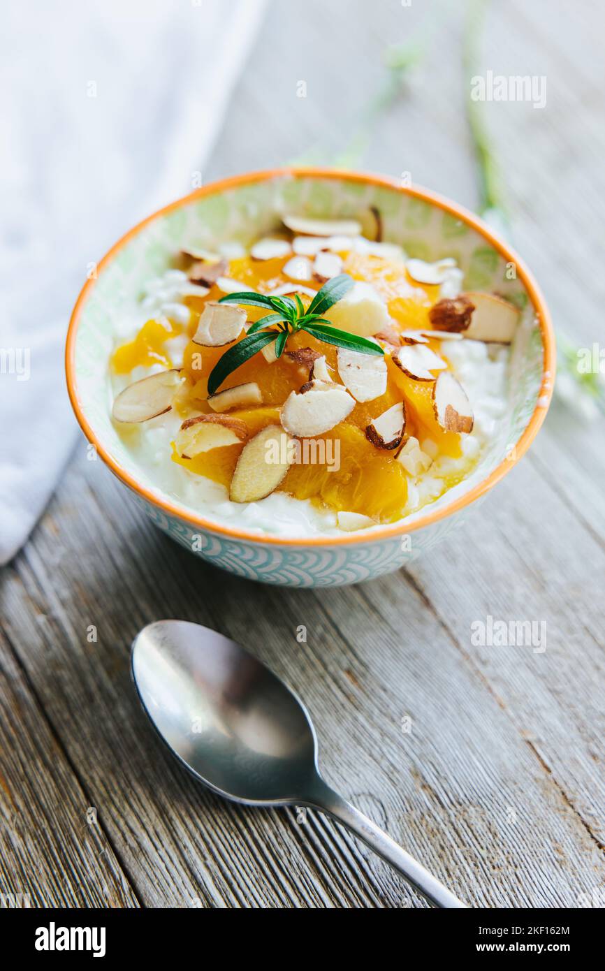 a vertical High angle closeup of a Fruit Bowl with Almonds Stock Photo ...