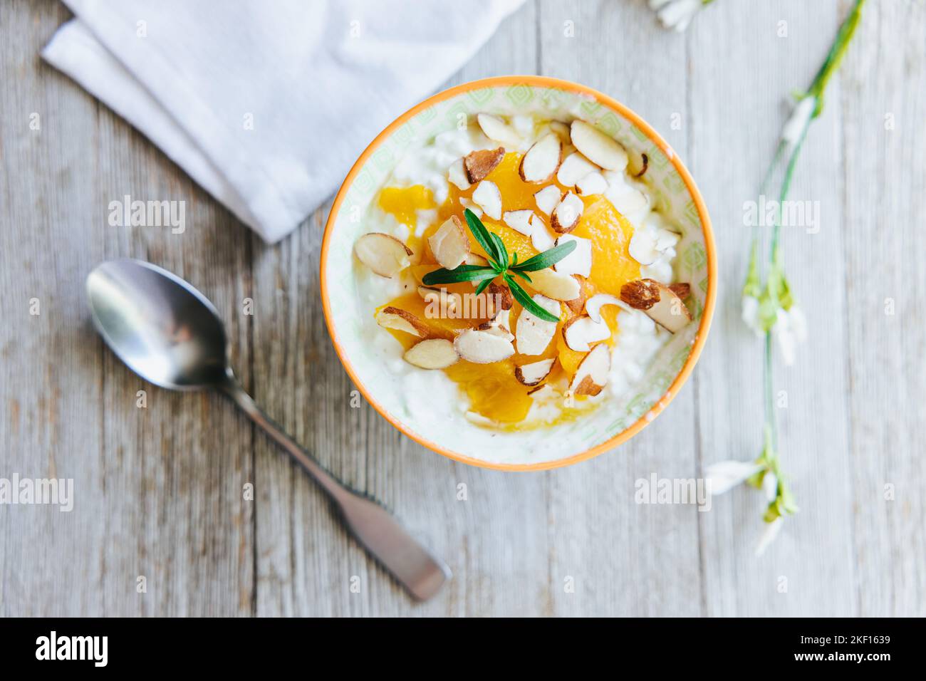 a high angle closeup of a Fruit Bowl with Almonds Stock Photo - Alamy