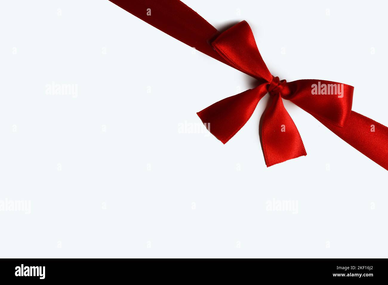 Elegant satin red ribbon bow isolated on white background Stock Photo ...