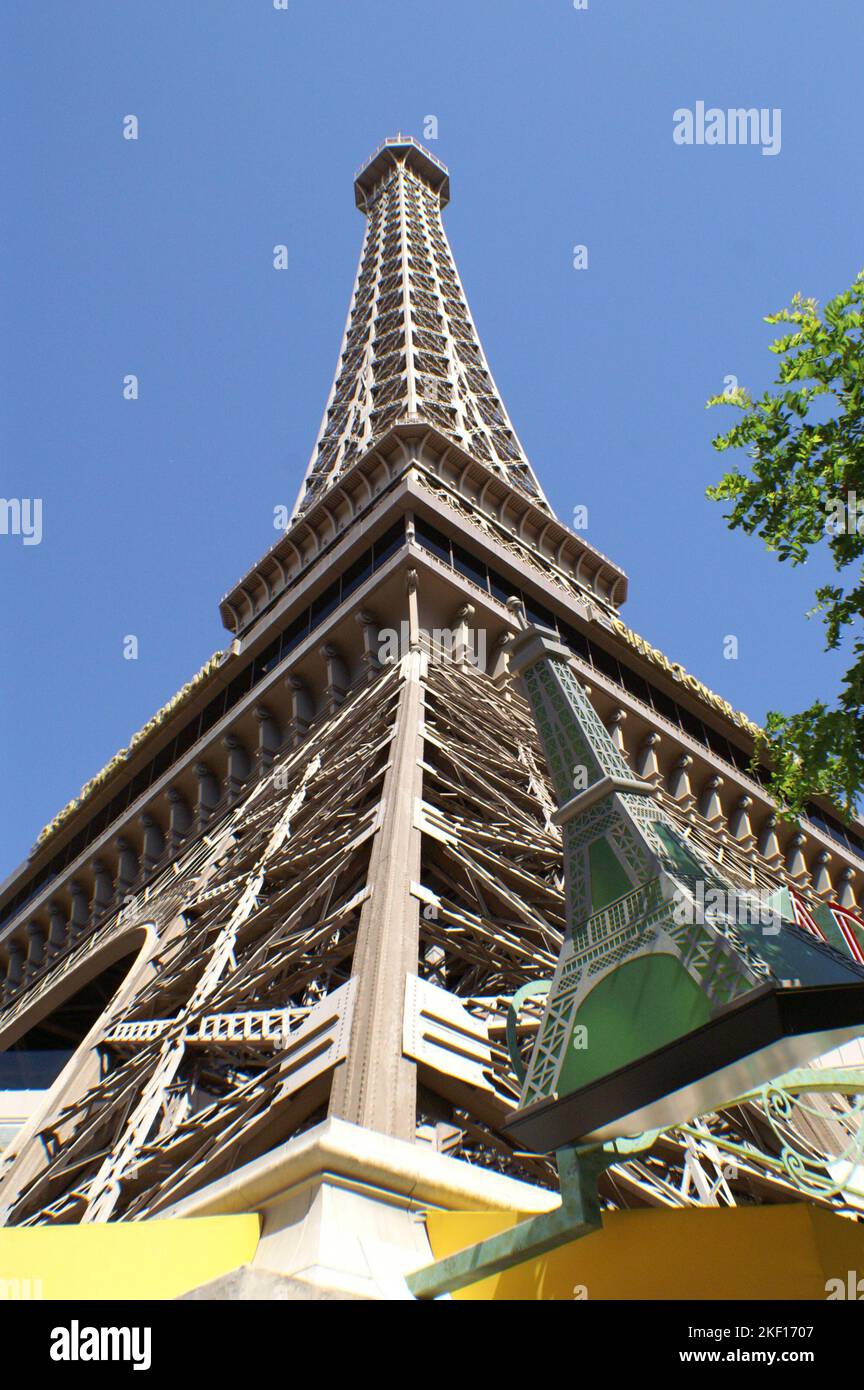 A low angle shot of the Eiffer Tower in Paris under clear cloudless sky ...