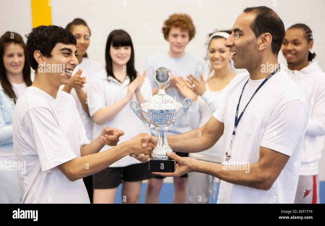 Sports Students: First Prize. A trophy presentation for a teenage ...