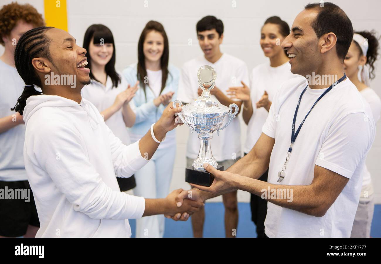 Sports Students: First Prize. A trophy presentation for a teenage ...