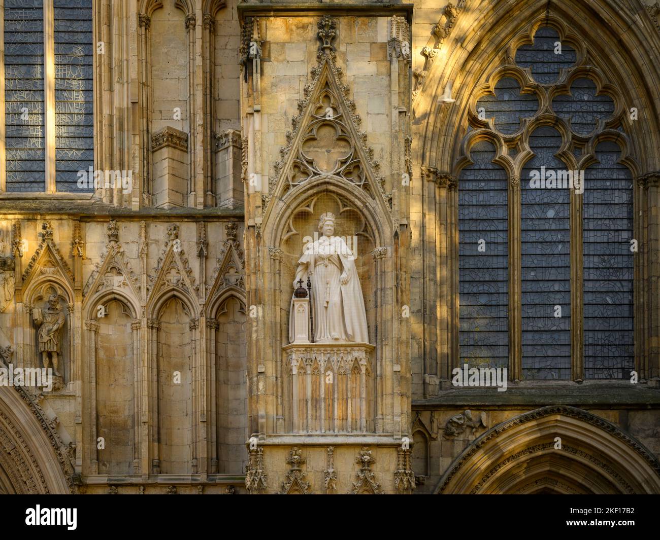 Elizabeth 2 limestone statue standing on high niche wearing ceremonial ...