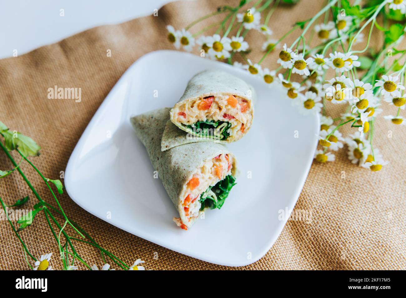 a High angle closeup of a salmon wrap sliced in half Stock Photo - Alamy