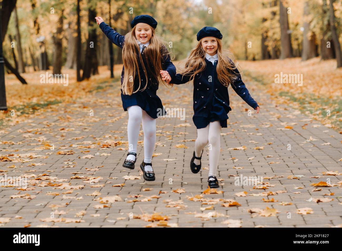 Happy children are running in a beautiful autumn park Stock Photo - Alamy