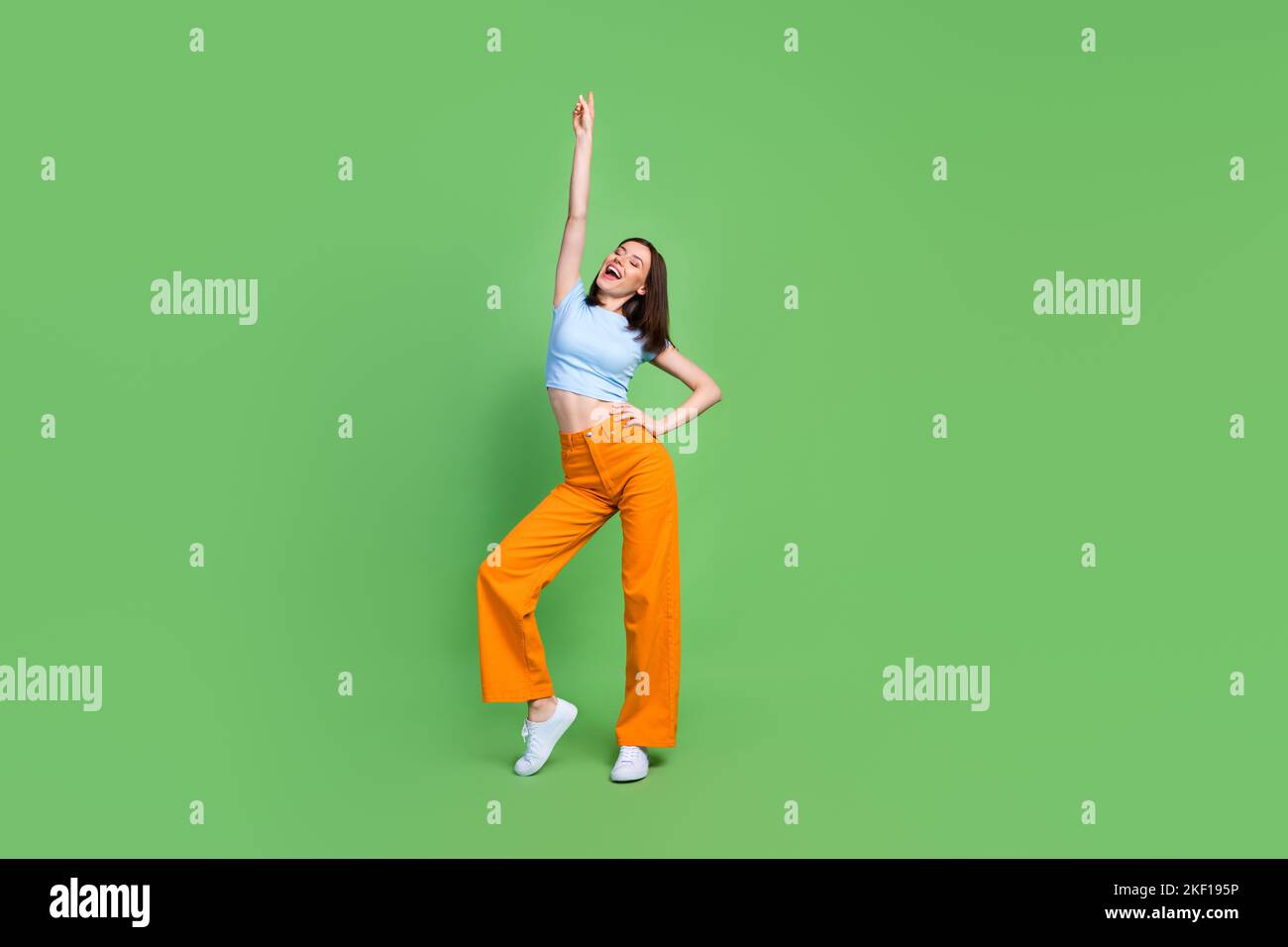 Full size photo of overjoyed gorgeous girl closed eyes point finger ...