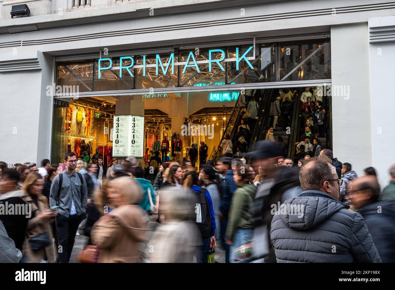 Many people waiting outside a Primark store in downtown Madrid Stock ...