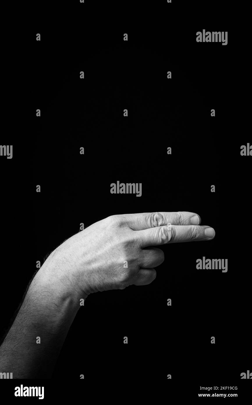 Dramatic black and white image of a male hand fingerspelling the Arabic ...