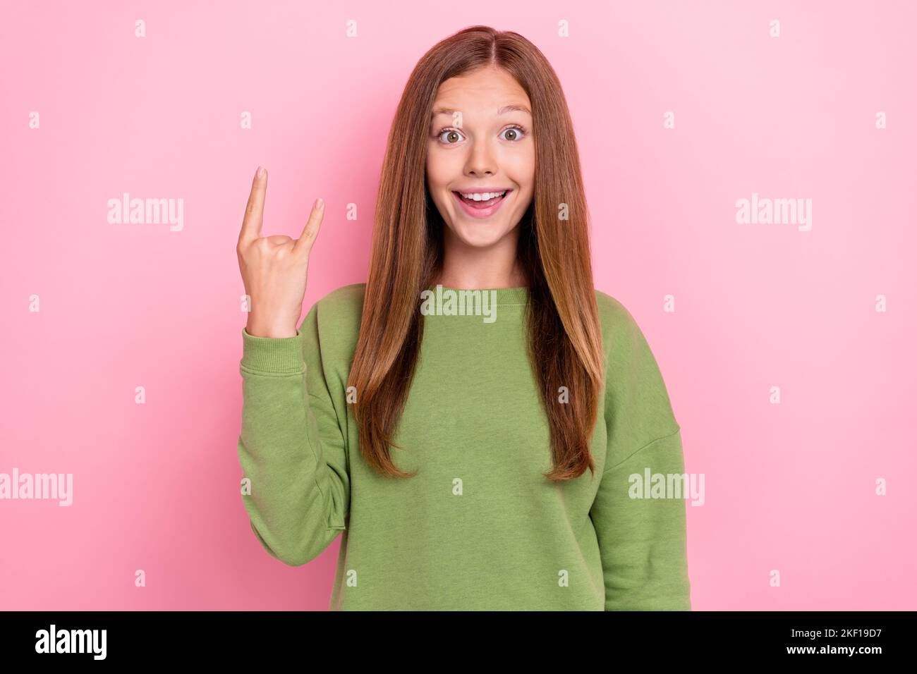 Photo of cool funky school girl dressed green sweatshirt showing hard ...