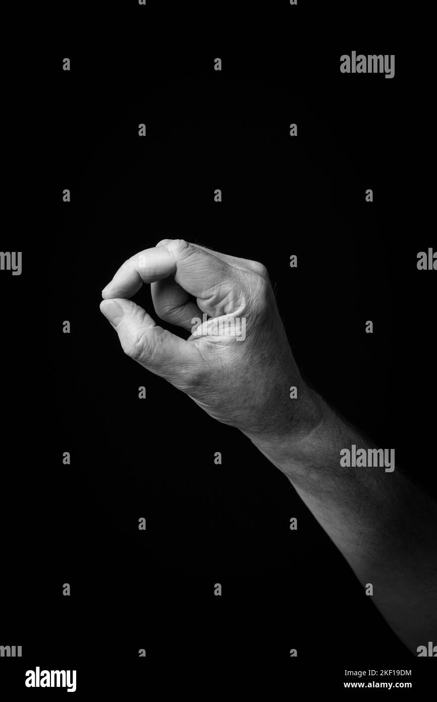 Dramatic black and white image of a male hand fingerspelling the Arabic ...