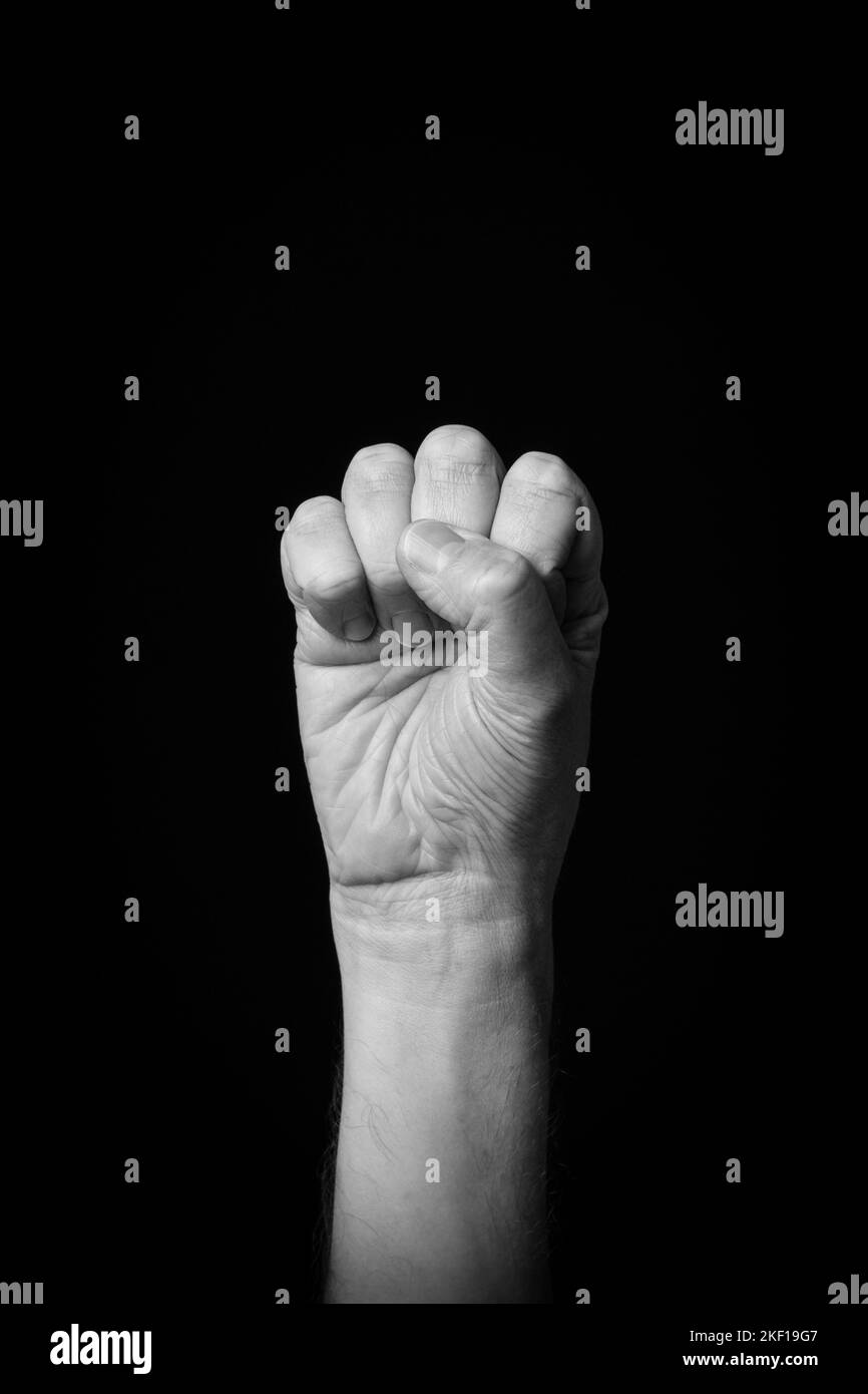Dramatic black and white image of a male hand fingerspelling the Arabic ...