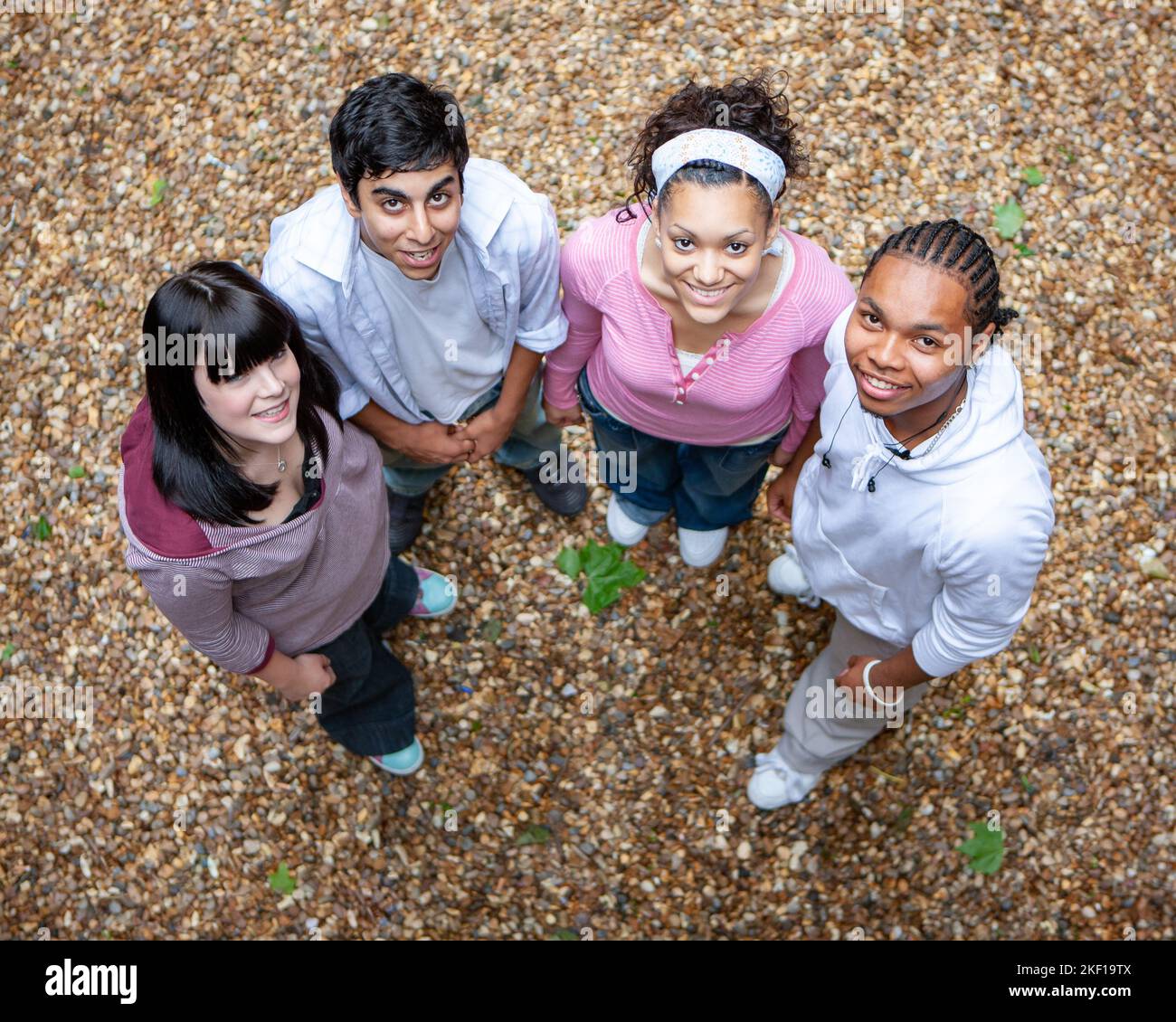 Teenage Friends. Elevated view looking down onto a diverse group of 4 ...