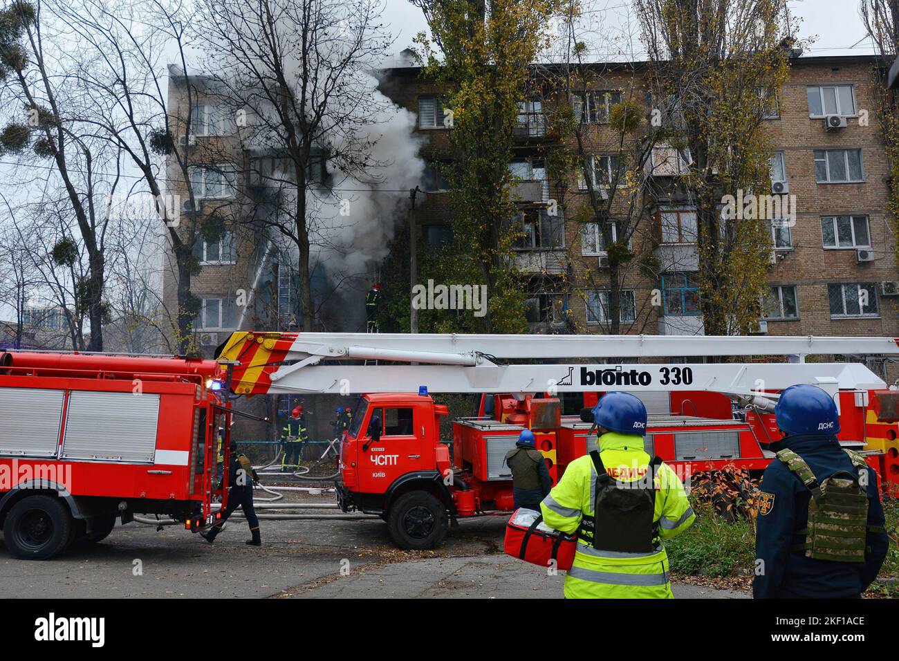Kyiv, Ukraine. 15th Nov, 2022. Firefighters work to put out a fire at a ...