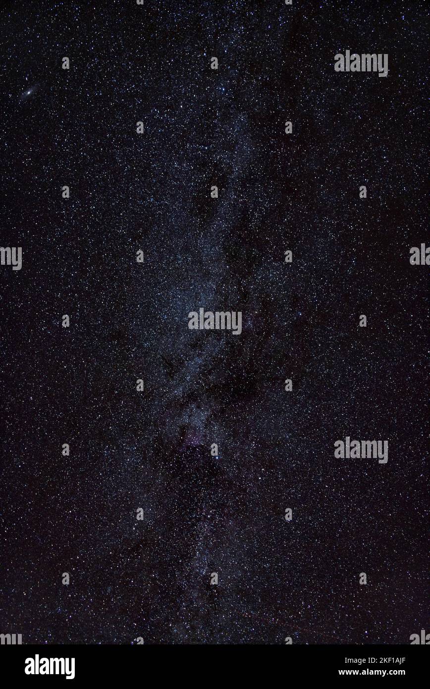 A vertical shot of a night sky milky way Stock Photo - Alamy