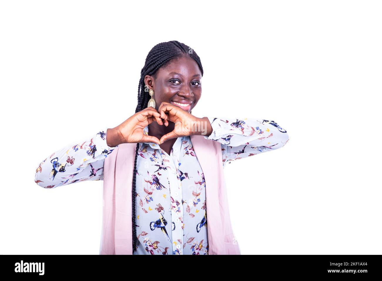 a beautiful young businesswoman in jacket standing on white background ...