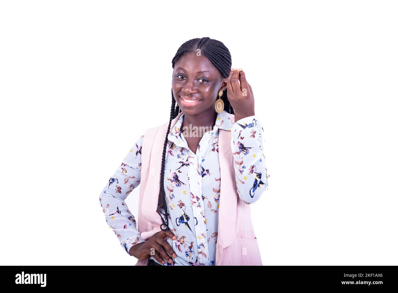 a beautiful young businesswoman in jacket standing on white background ...