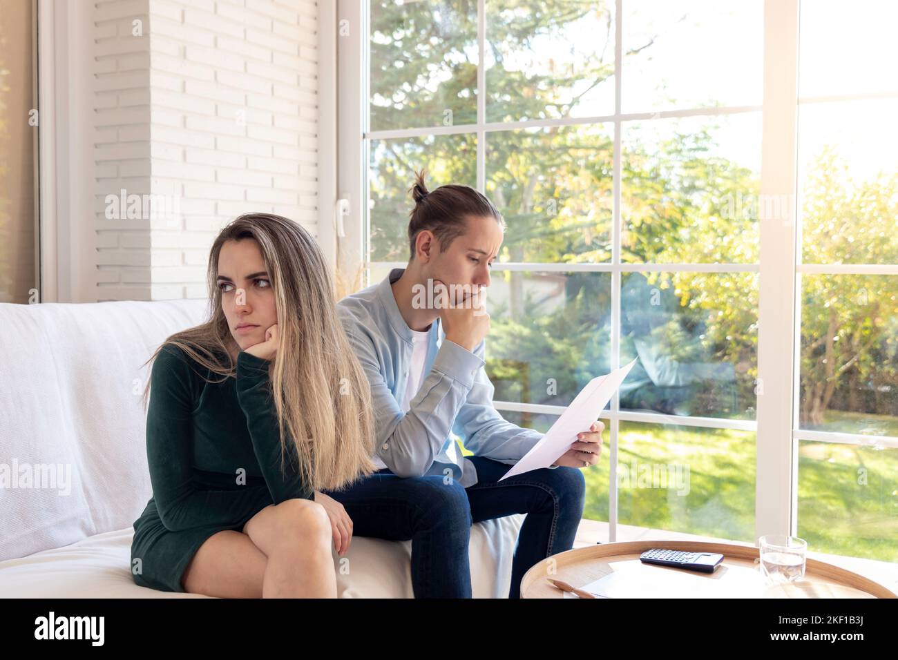 Young couple mad at each other because of the count expenses, making ...