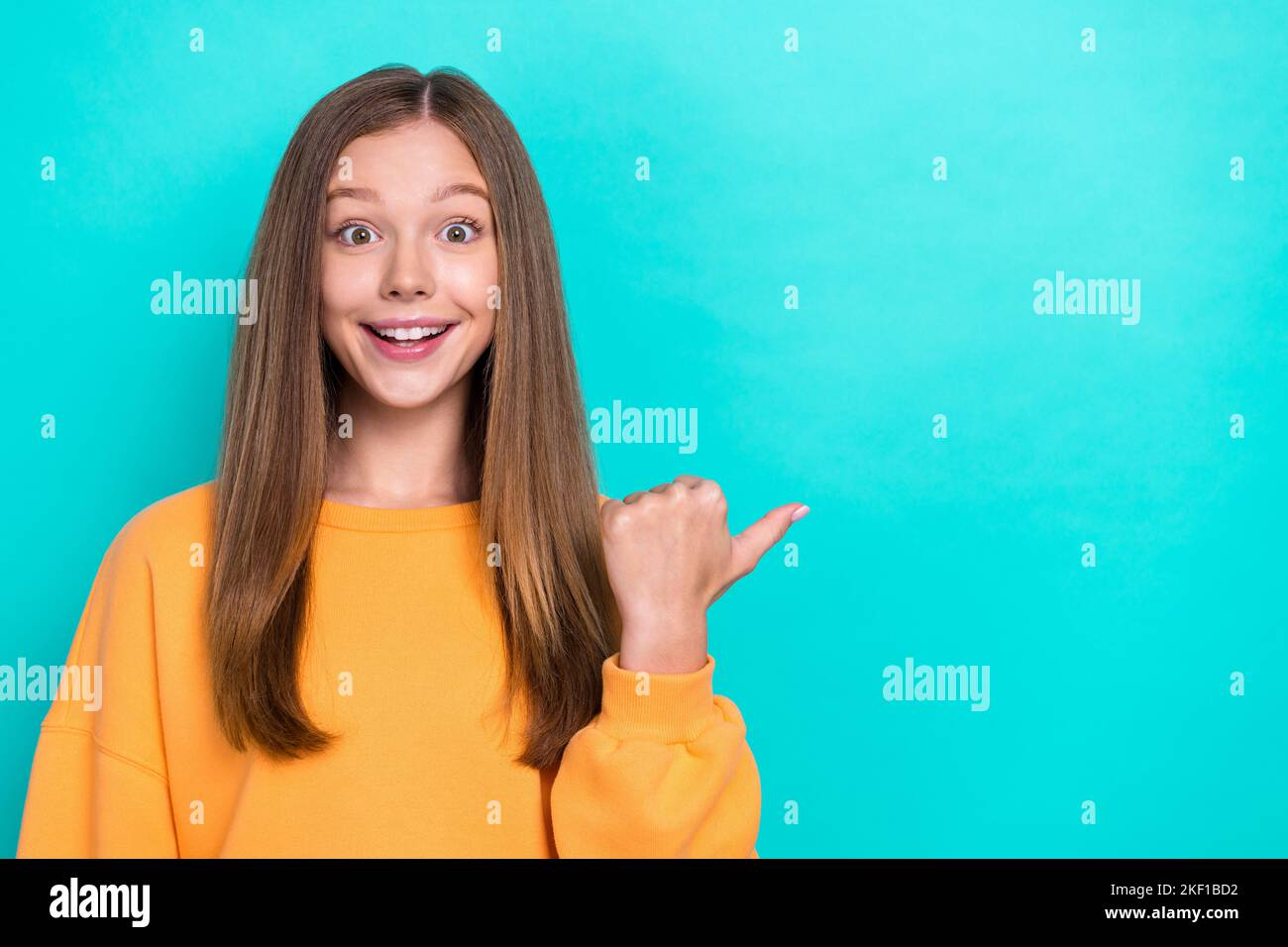 Closeup portrait photo of cute teen girl wear orange pullover finger ...