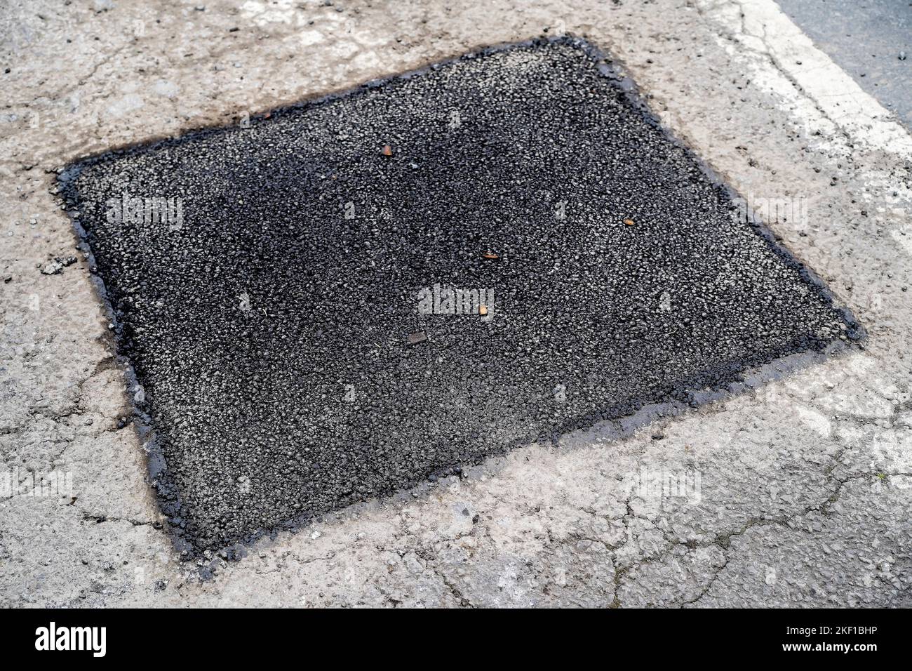 Tarmac pavement repair Stock Photo - Alamy